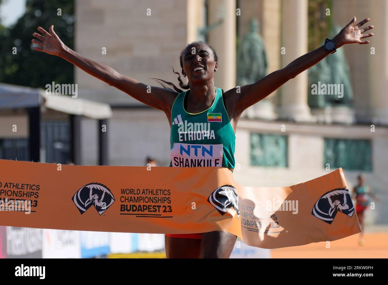 Amane Beriso Shankule, of Ethiopia, celebrates as she crosses the ...