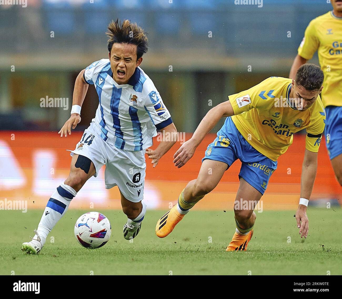 Takefusa Kubo (blue) of Real Sociedad dribbles the ball in a Spanish La ...