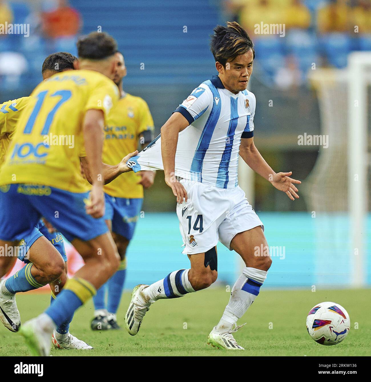 Takefusa Kubo (blue) of Real Sociedad dribbles the ball in a Spanish La ...