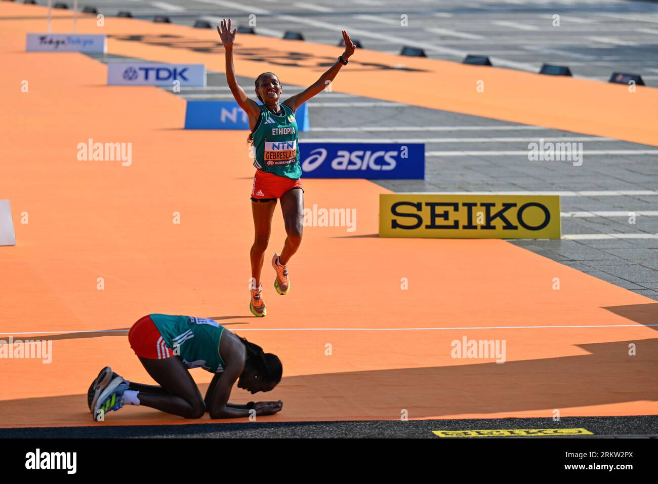 Amane Beriso Shankule of Ethiopia reacts after crossing the finish line ...