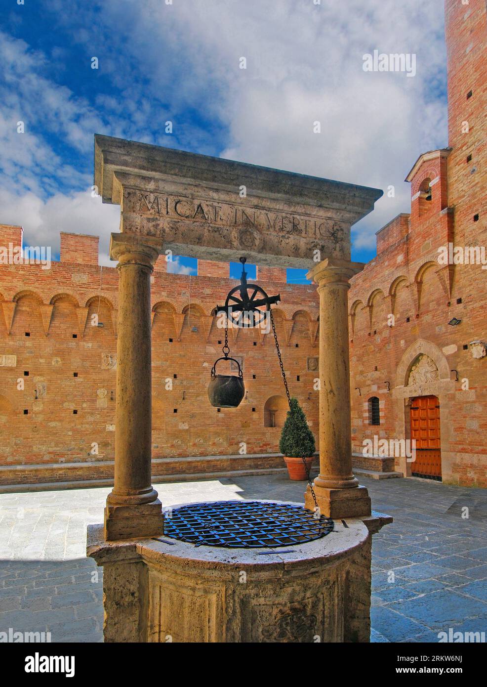 Courtyard of the Palazzo Chigi Saracini with medieval walls and ...