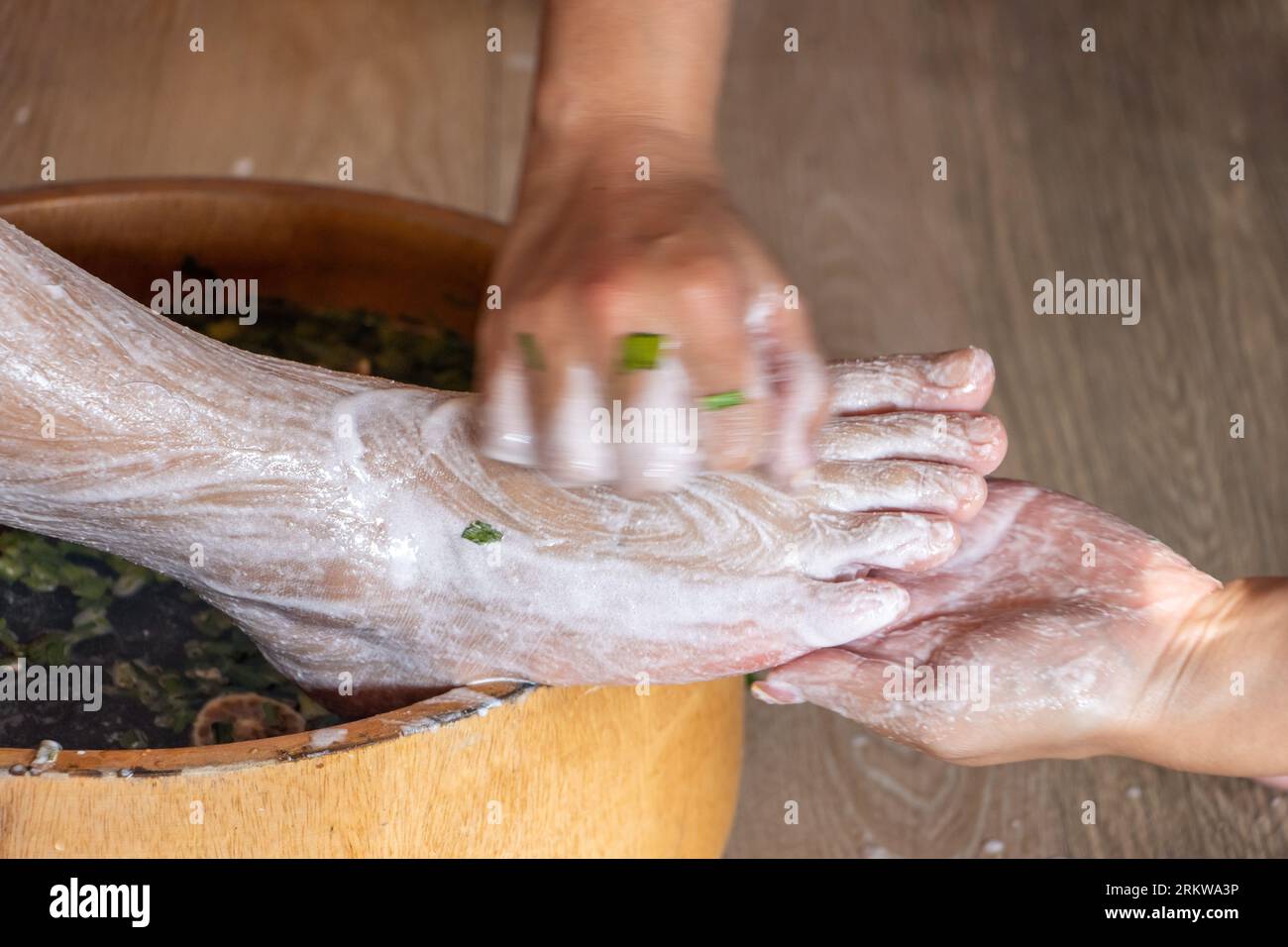 Foot care in a natural bath Stock Photo - Alamy