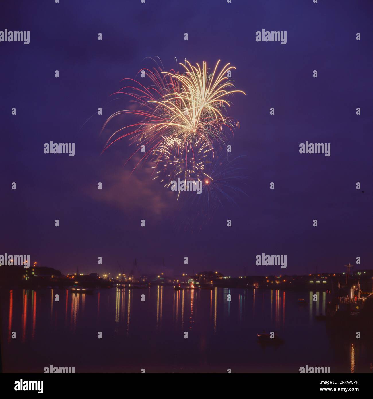 Fireworks exploding over a River Stock Photo - Alamy