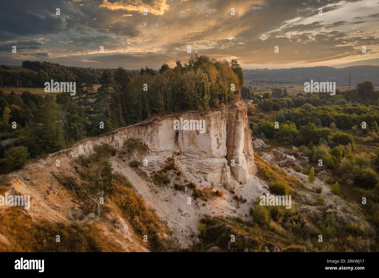 Scenic clay cliff with trees. Old clay quarry Stock Photo - Alamy