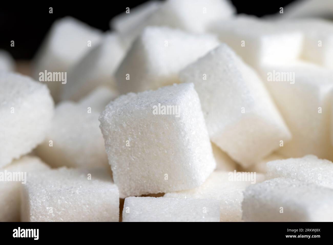 White sugar made from beetroot, cubes of white beet sugar close-up ...