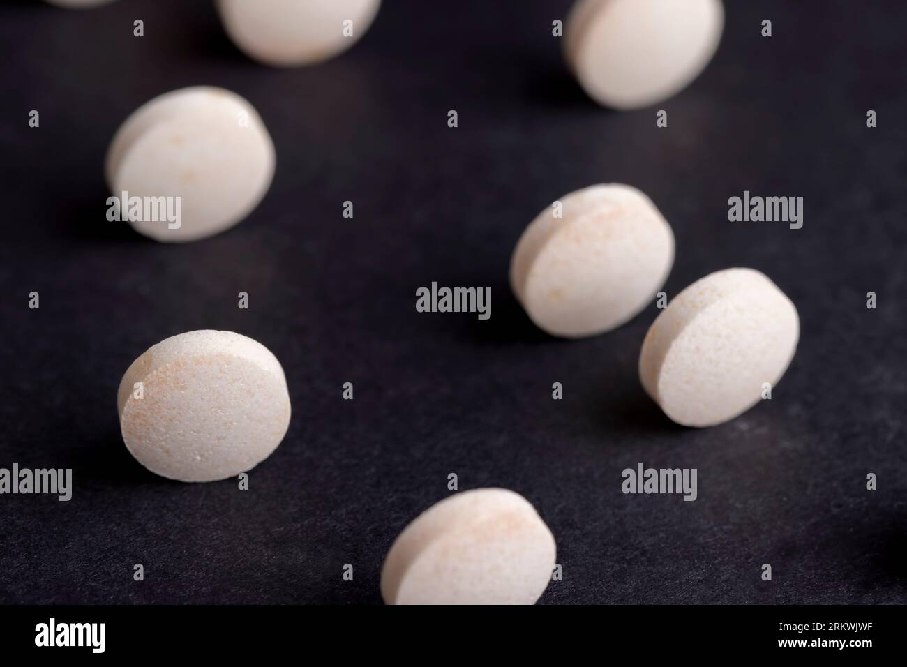 Open and unpacked tablets close-up, a large number of identical medical ...
