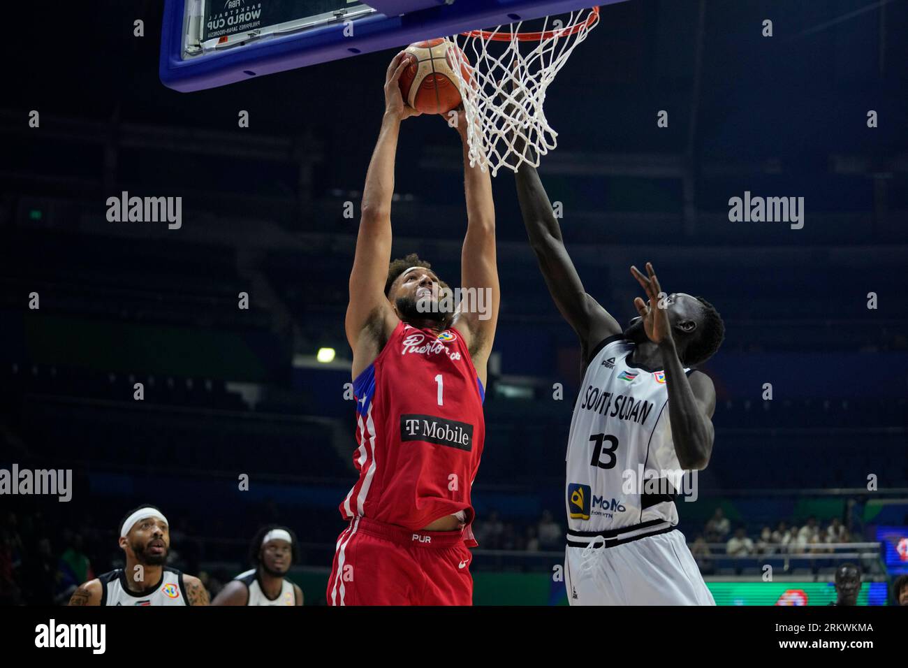 Puerto Rico forward George Conditt (1) against South Sudan forward ...