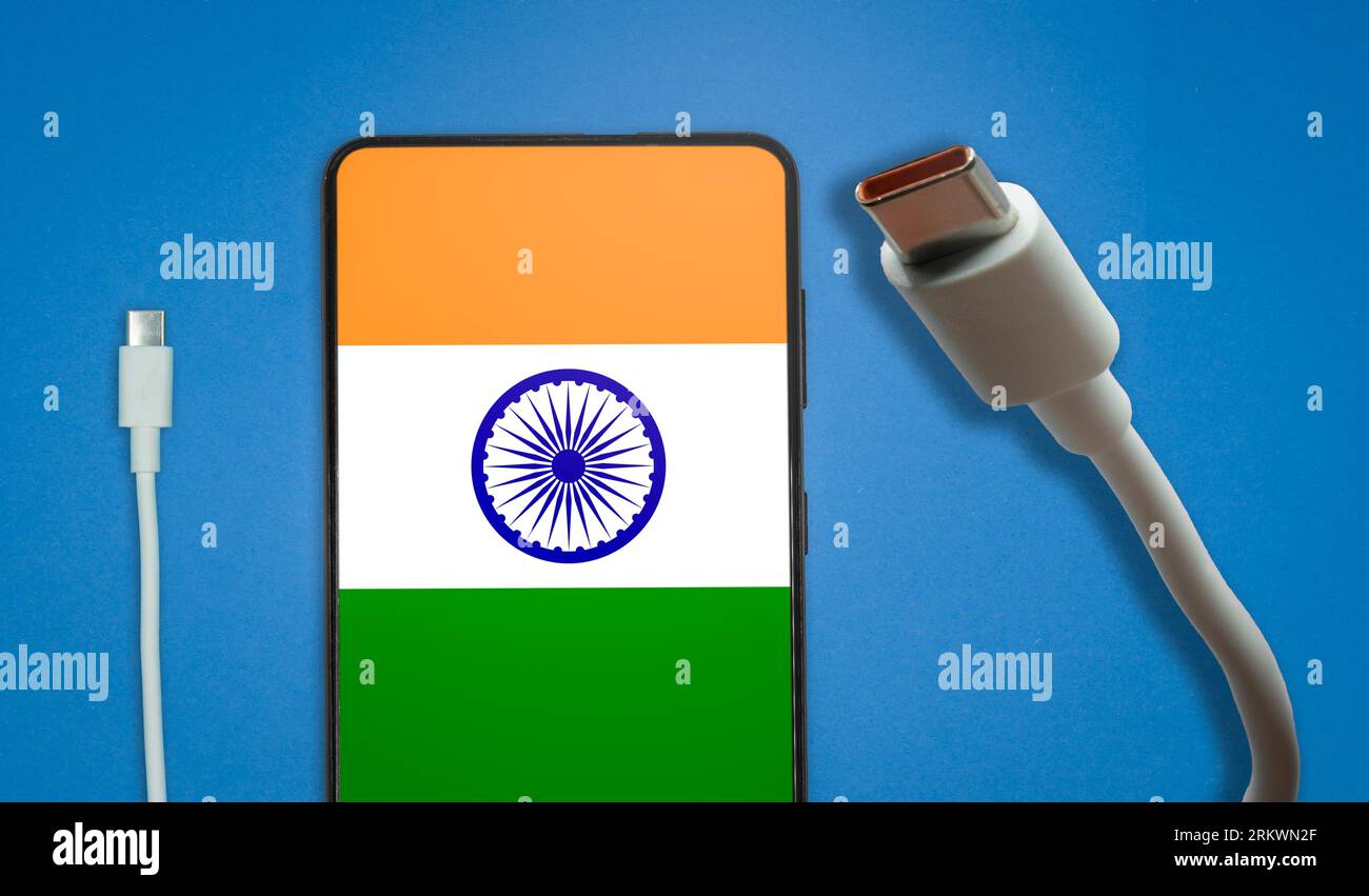 USB-C cable and a smartphone with the Indian Flag on screen Stock Photo ...