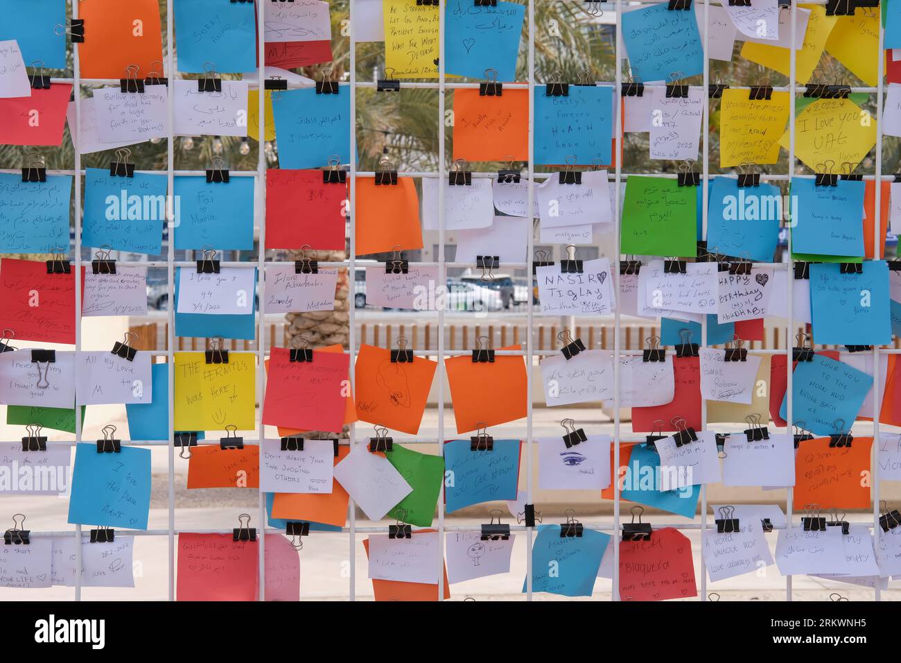 Multi-colored paper notes, stickers with names , memo, notice, requests ...