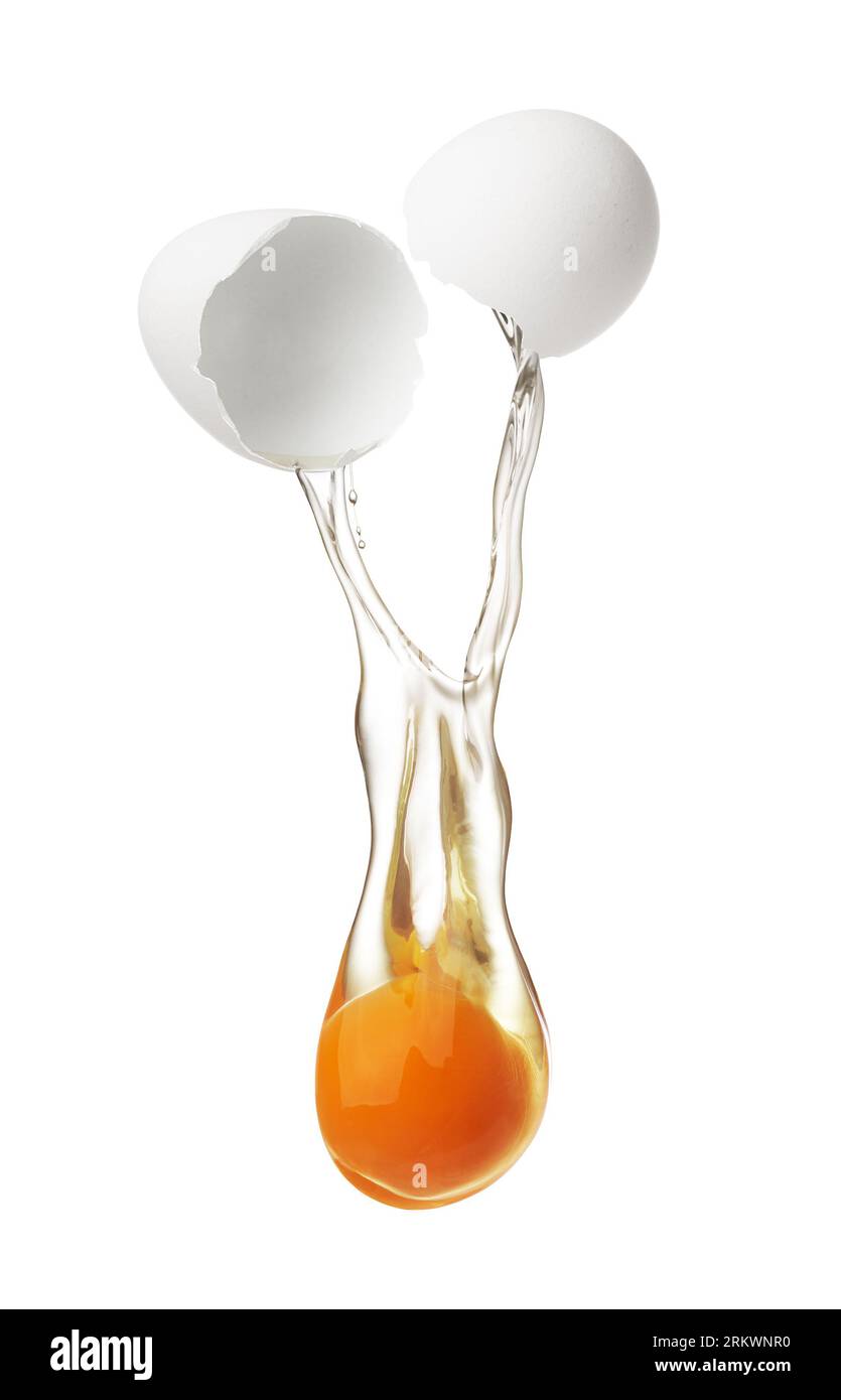 Egg yolk and white dropping out of cracked shell Stock Photo - Alamy
