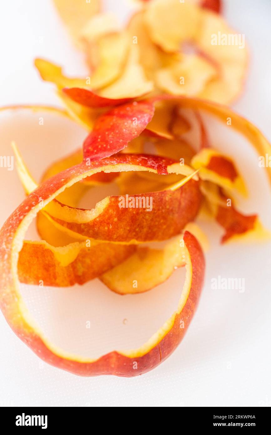 Peeling red apples Stock Photo - Alamy