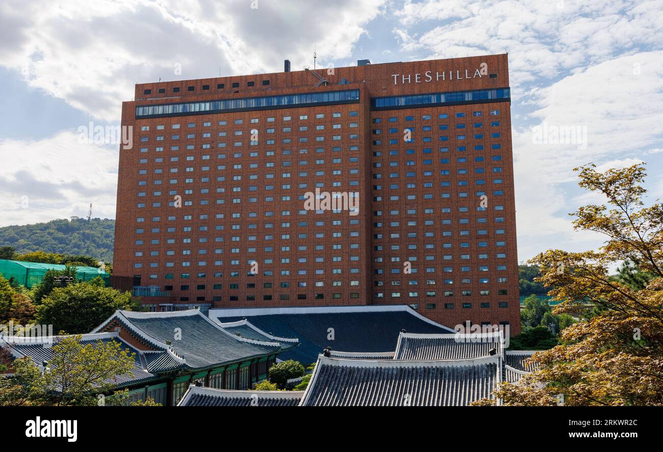 A contemporary high-rise hotel building, the Shilla Resort, stands ...