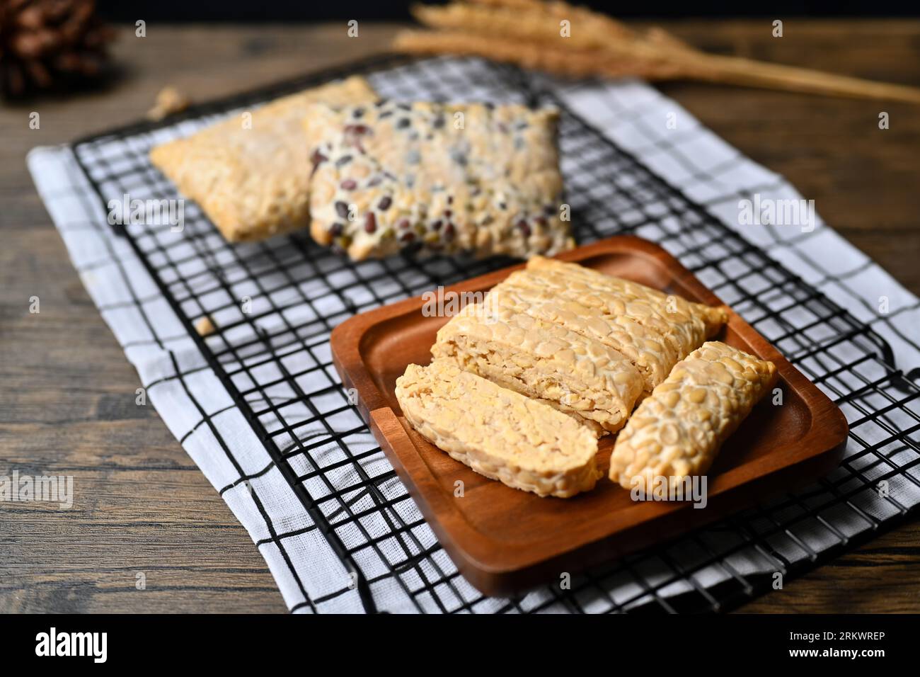 Slice of tempeh on kitchen tabletop. Traditional food of Indonesia ...