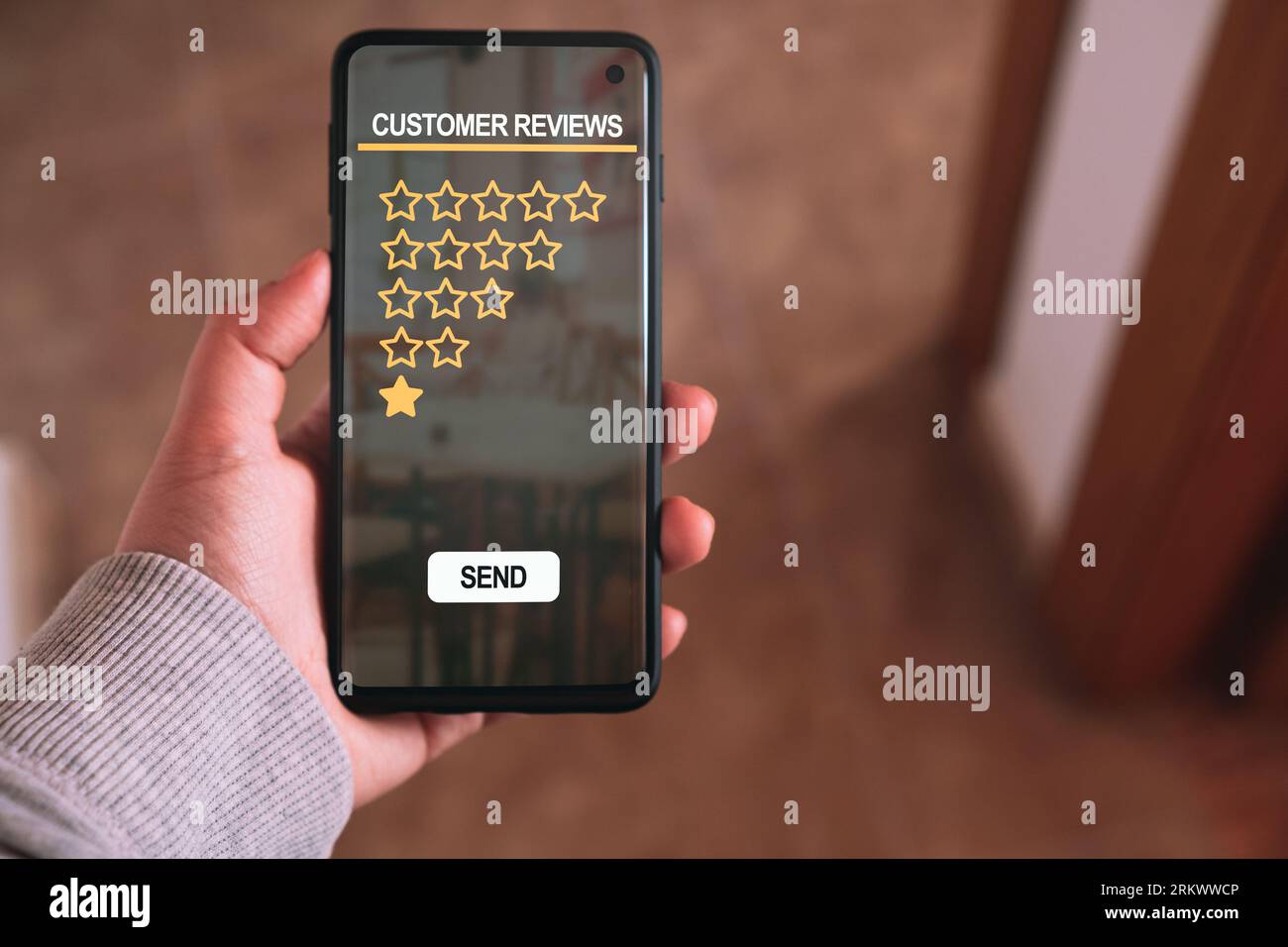 Woman rating negative a service on smartphone. Customer review ...