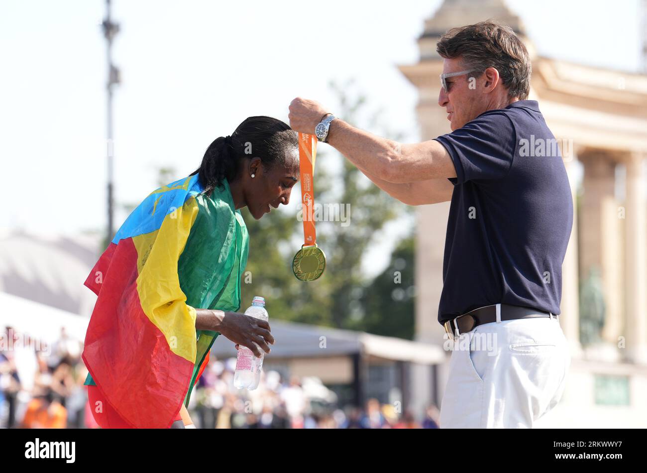 Ethiopia's Amane Beriso Shankule is presented with her gold medal by ...