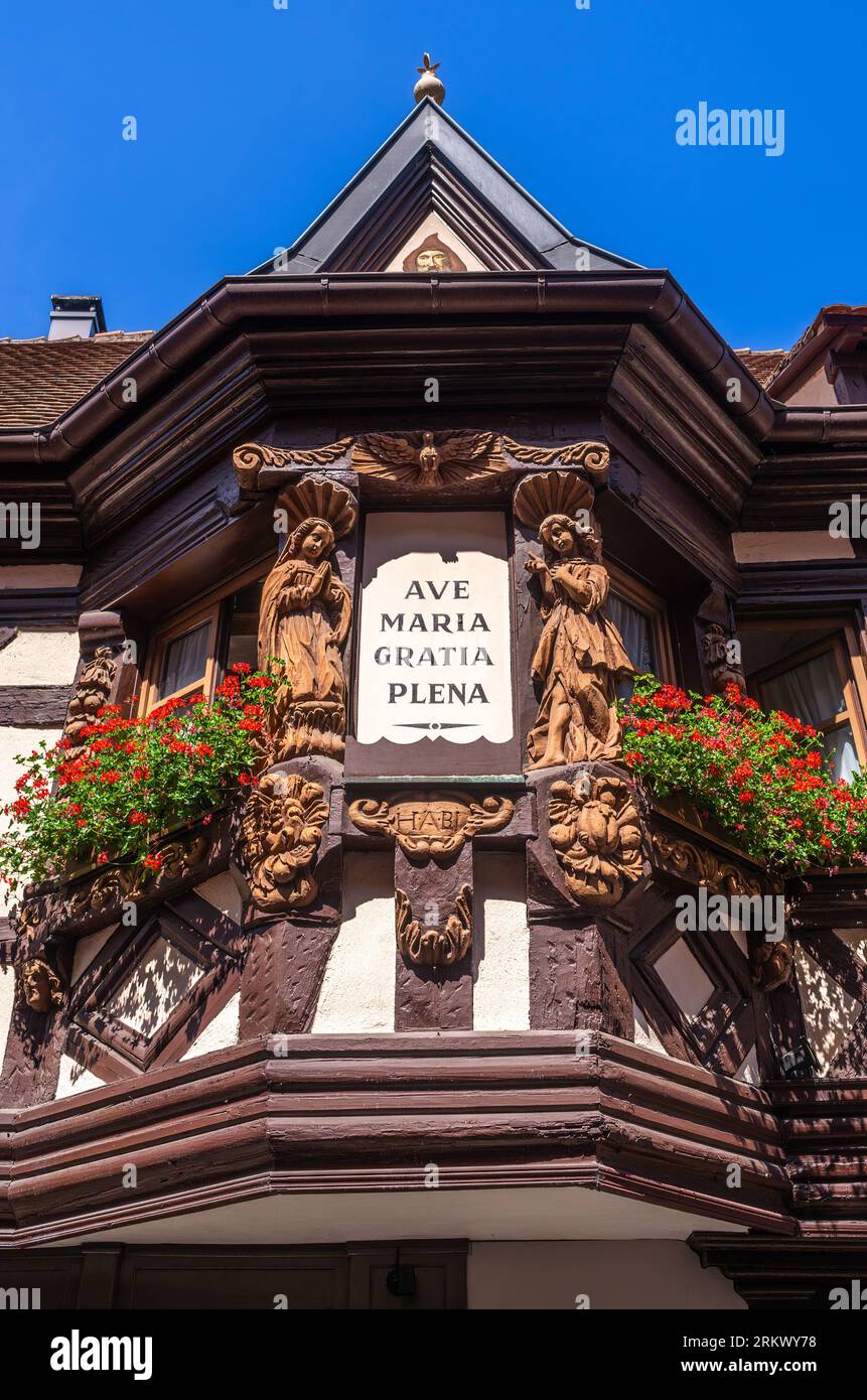 Historical facade with the prayer of Ave Maria in Ribeauville, a ...