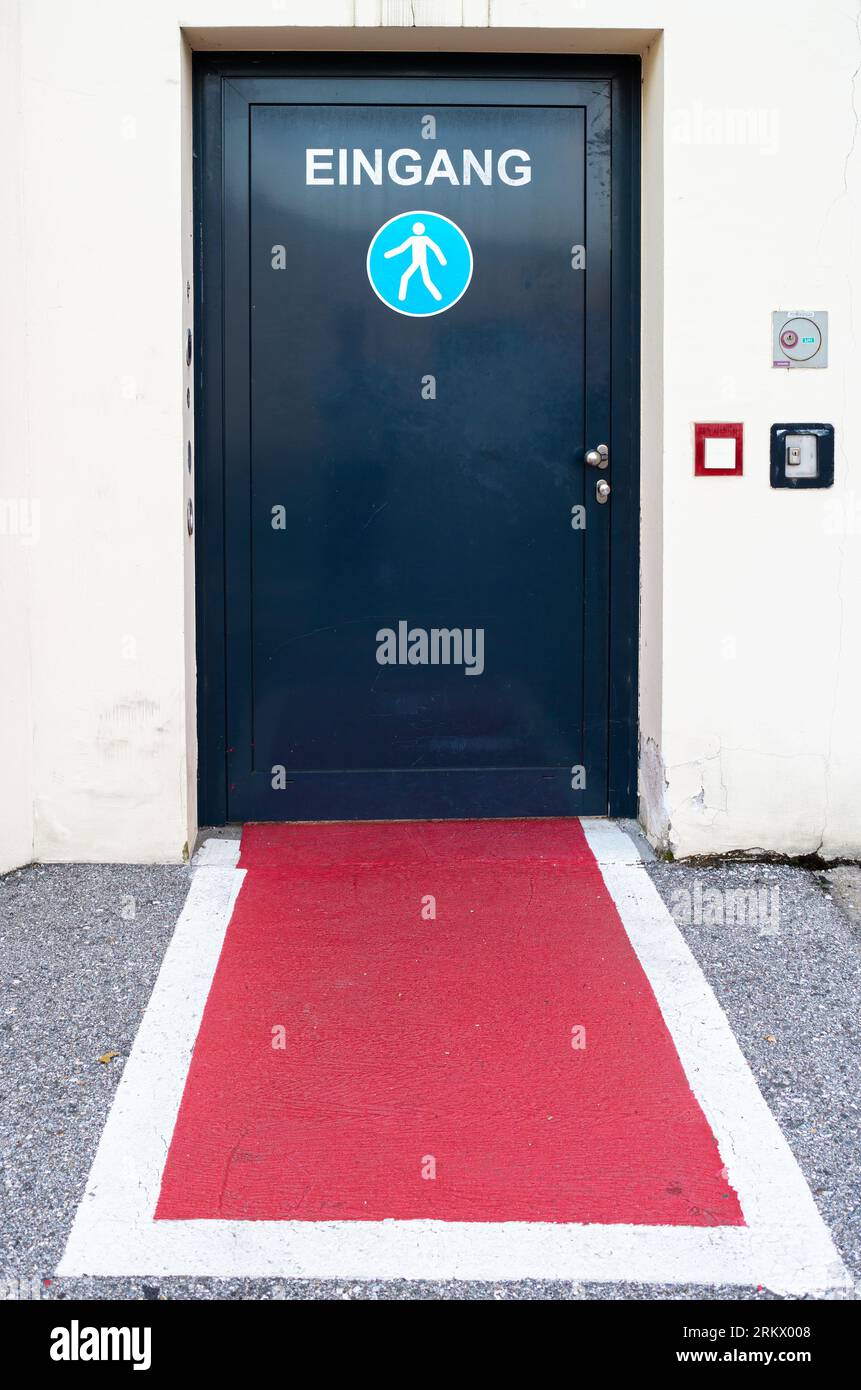 The metal industrial door with the sign in german - English translation ...