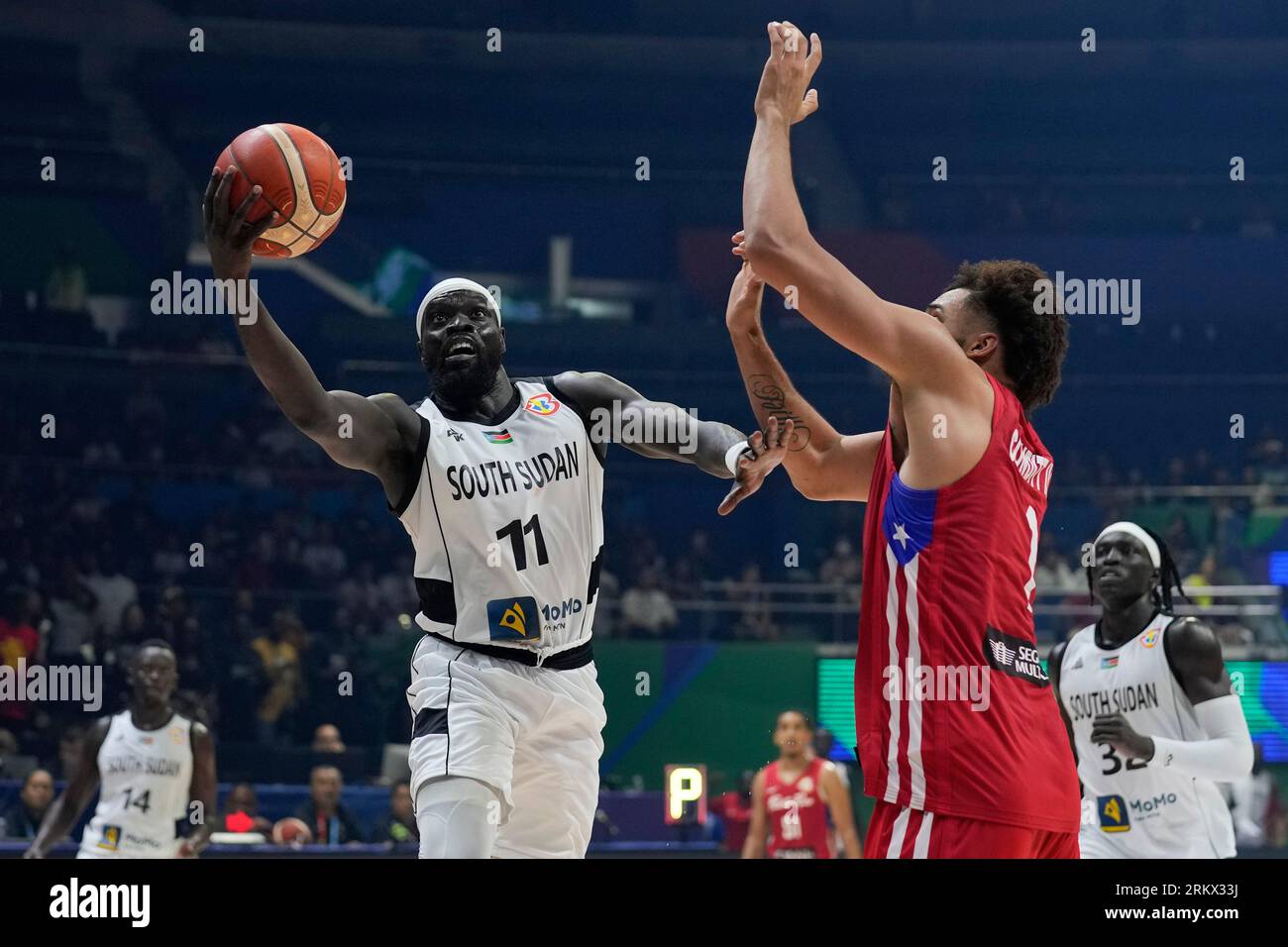 South Sudan guard Marial Shayok (11) against Puerto Rico forward George ...