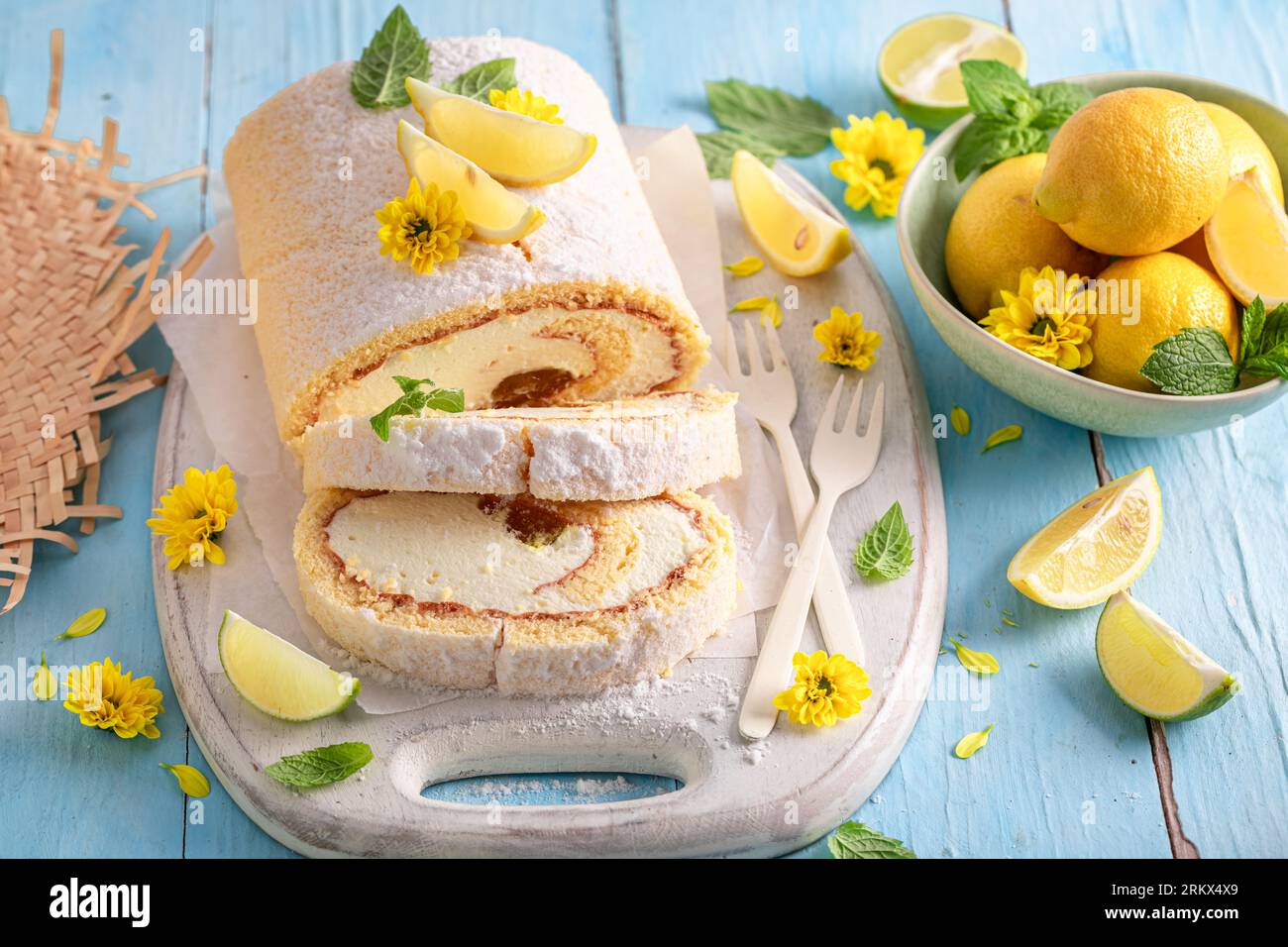 Sweet mango swiss roulade made of citrus fruit. Swiss roll with caster ...