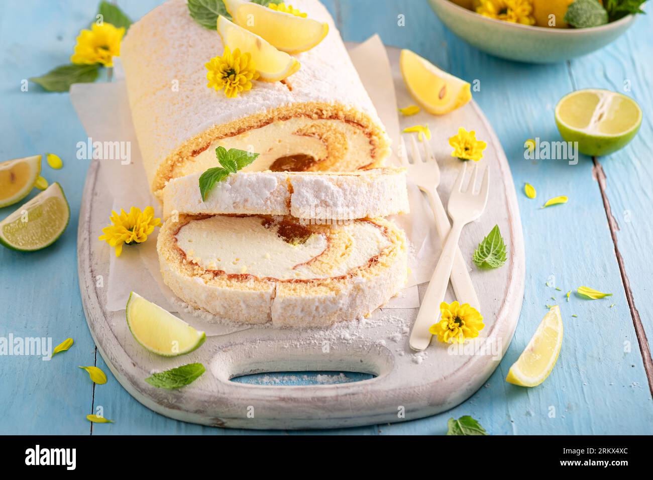 Sweet mango swiss roulade served as summer dessert. Swiss roll with ...