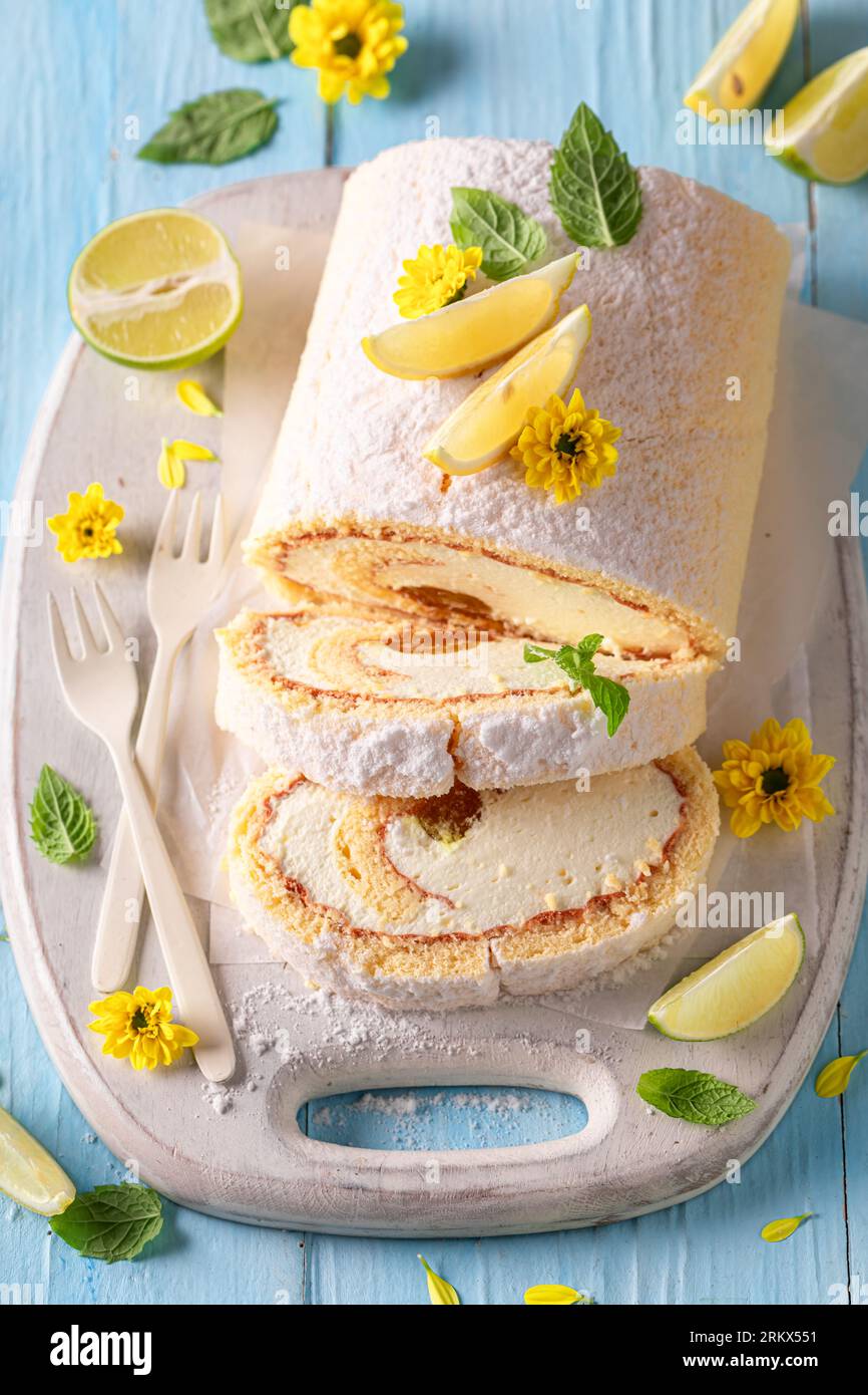 Delicious mango swiss roulade served as summer dessert. Swiss roll with ...