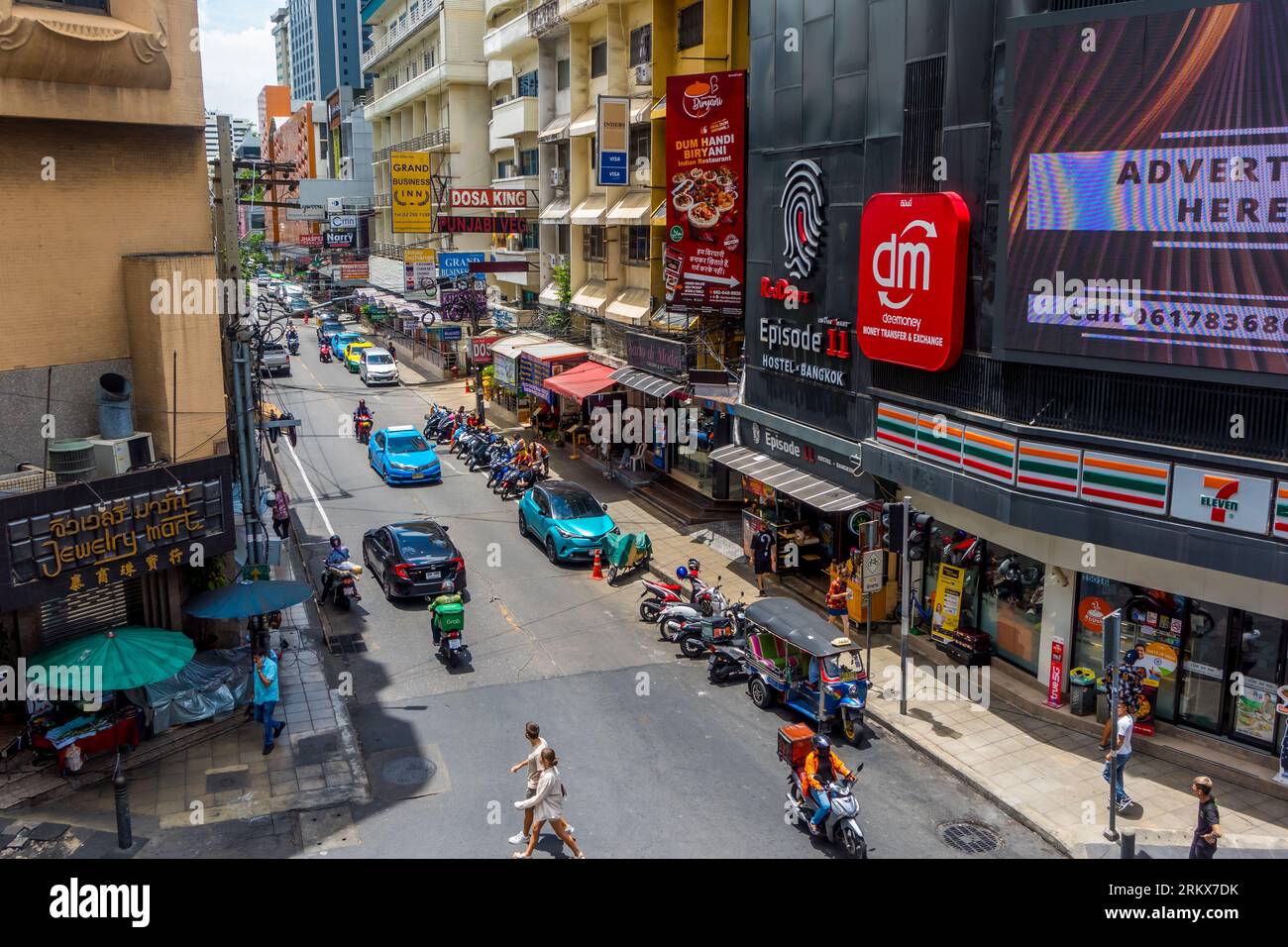 A vibrant and bustling scene of modern architecture and traffic in the ...