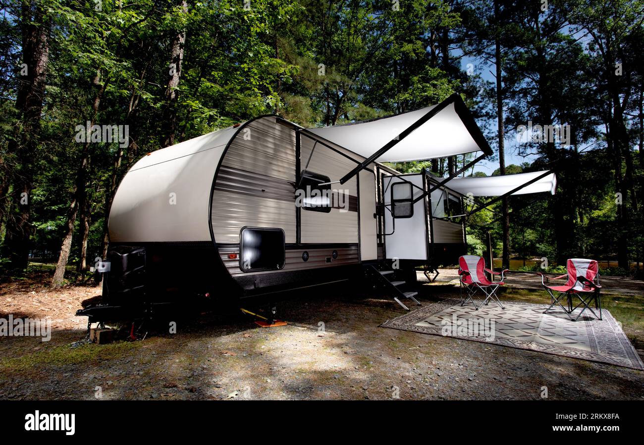 RV Campsite in the middle of the day with the units awnings out over a ...