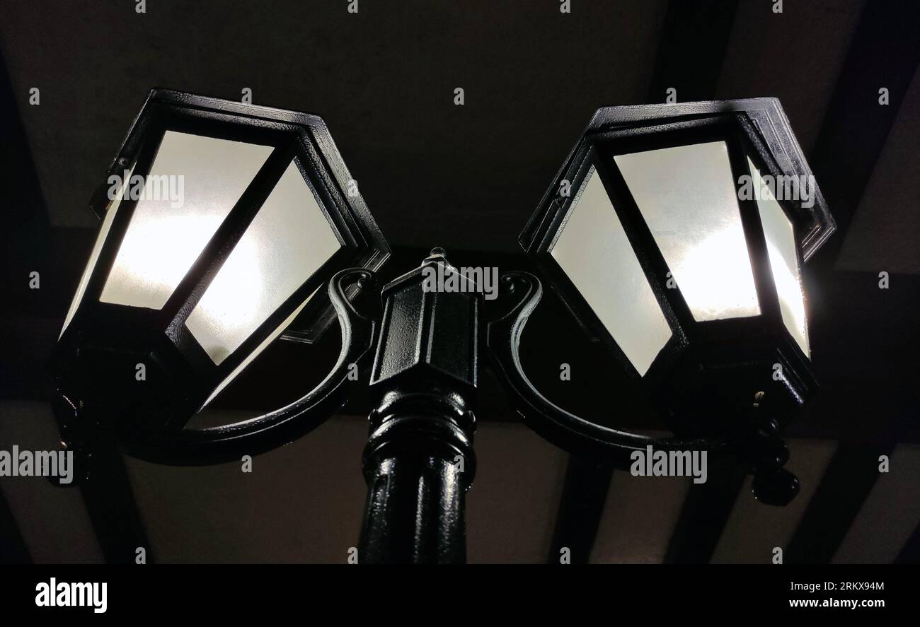 Old street lights in the dark background, vintage lamps, architecture ...