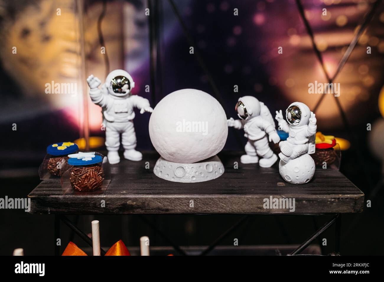 A collection of mini astronaut figures arranged in a circle around a ...