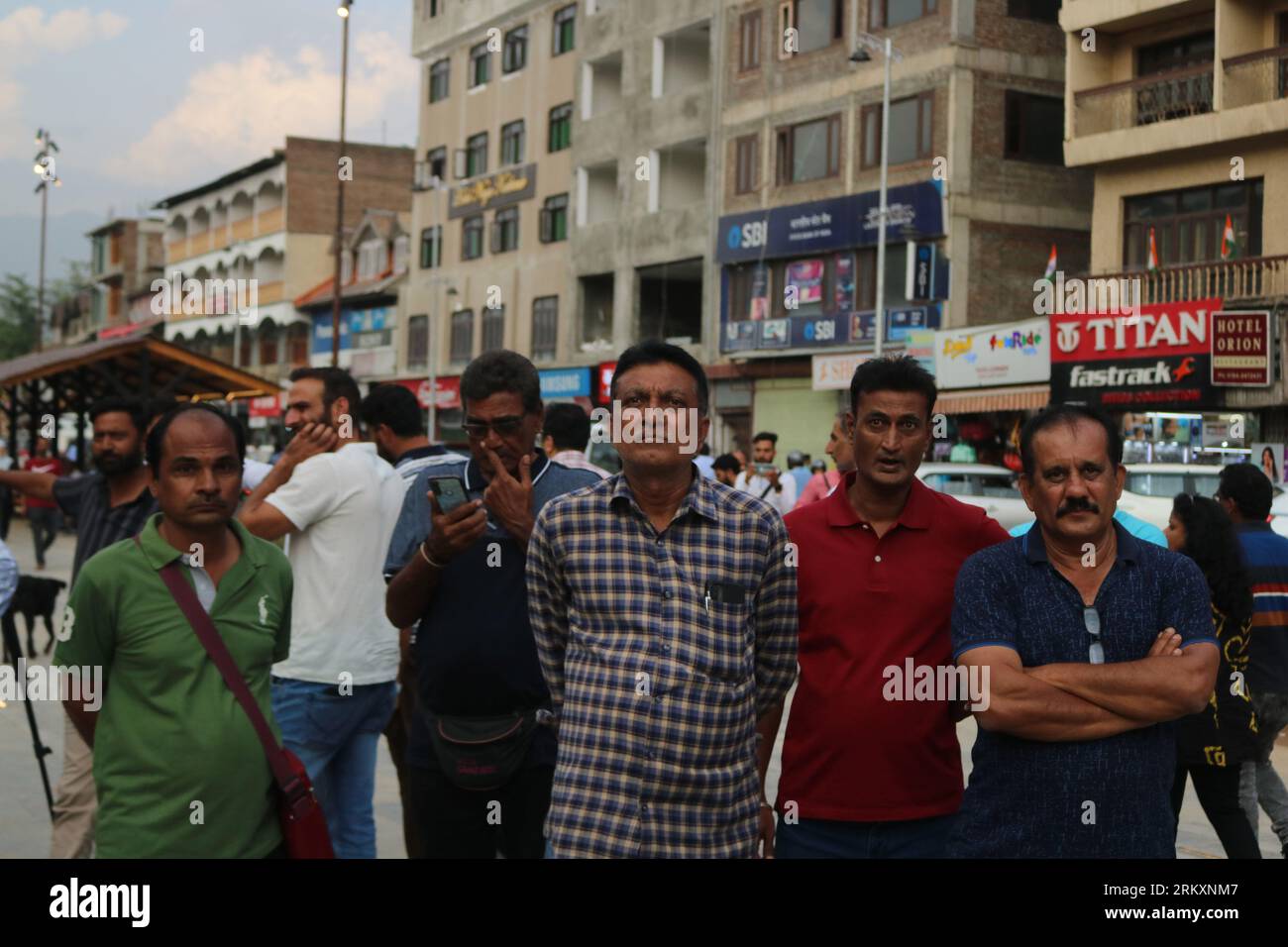 August 23,2023, Srinagar Kashmir, India : Indian tourists watch a live ...