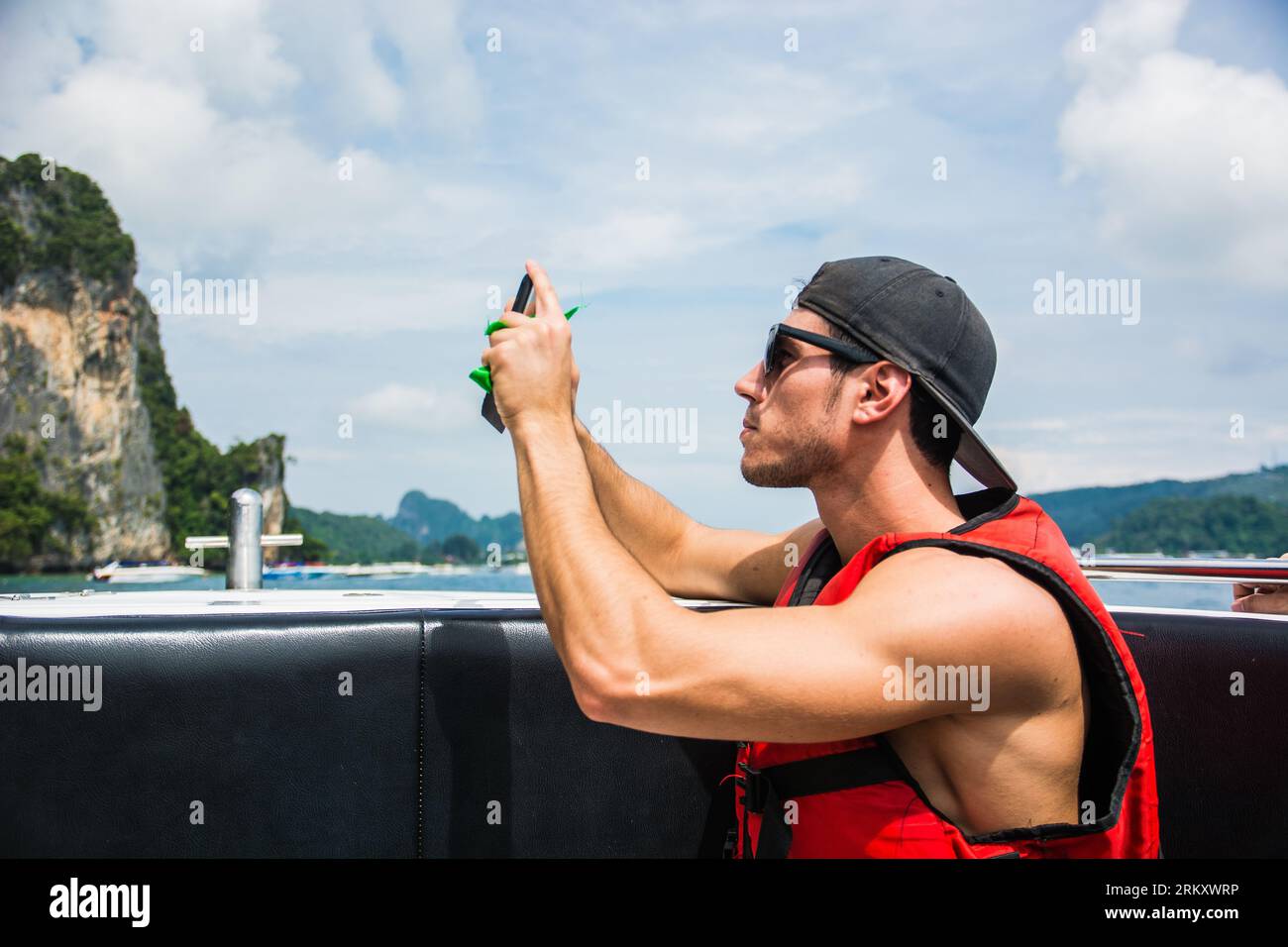 Photo of a man in a red life jacket Stock Photo - Alamy