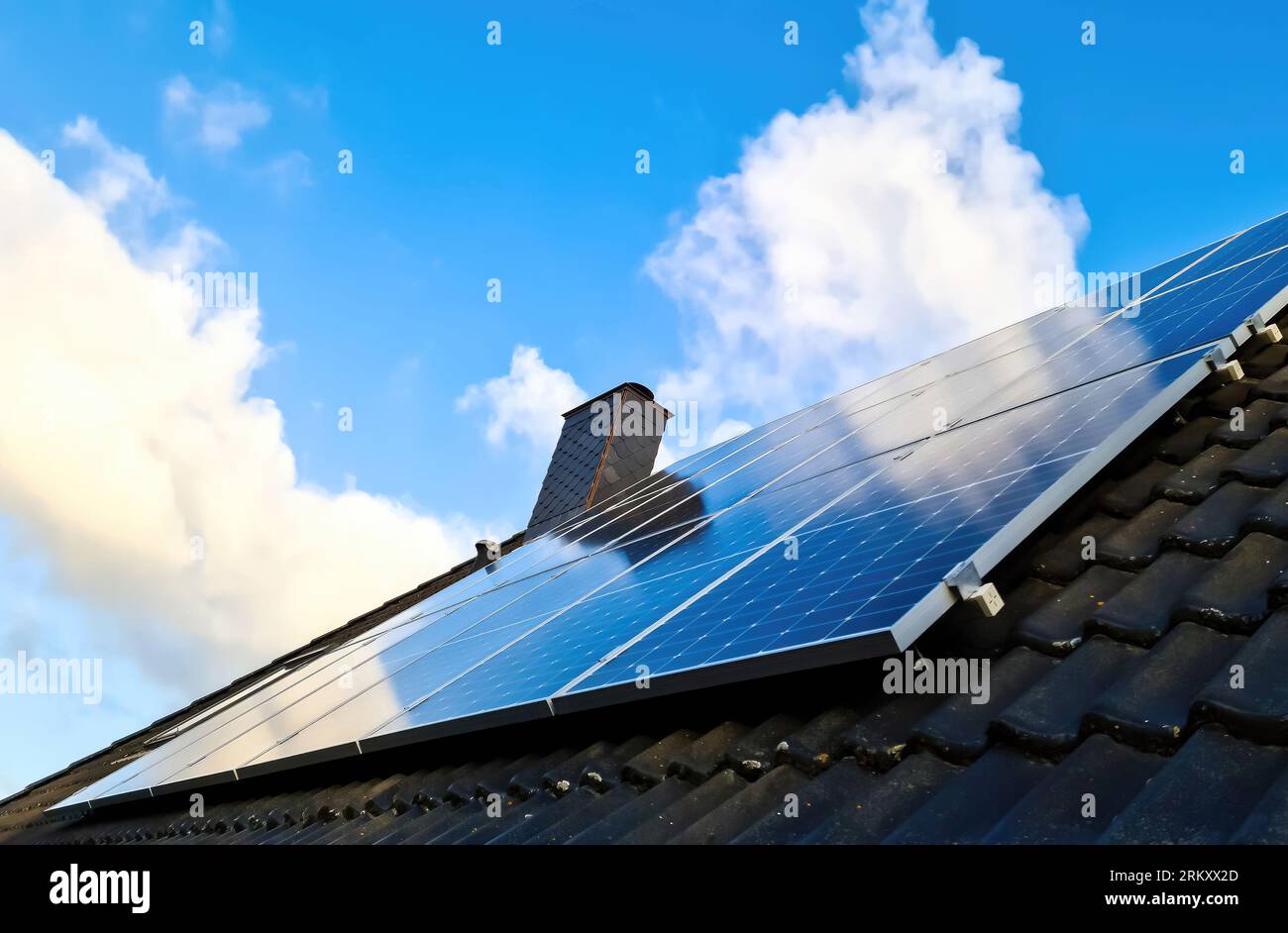 Solar Panels Producing Clean Energy On A Roof Of A Residential House ...
