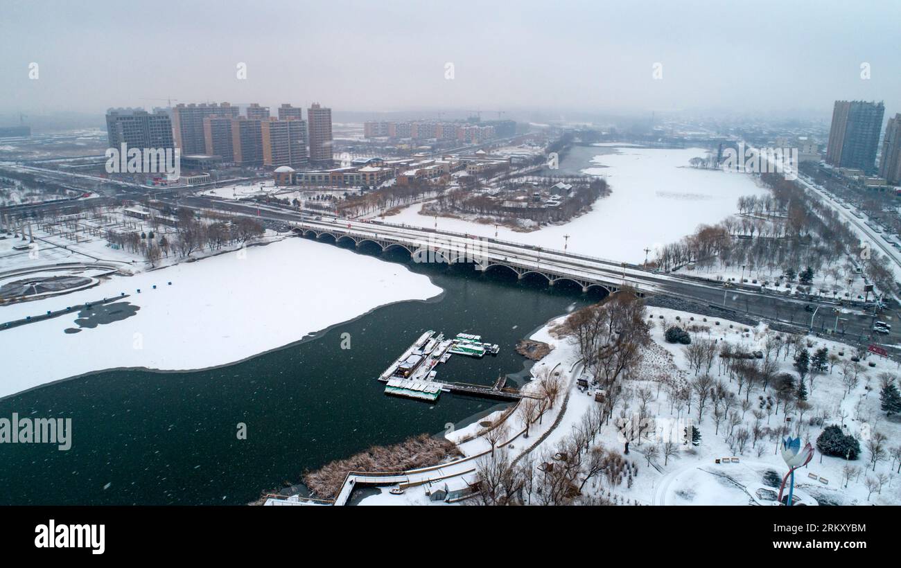 Snowscape of waterfront city, aerial photo Stock Photo - Alamy