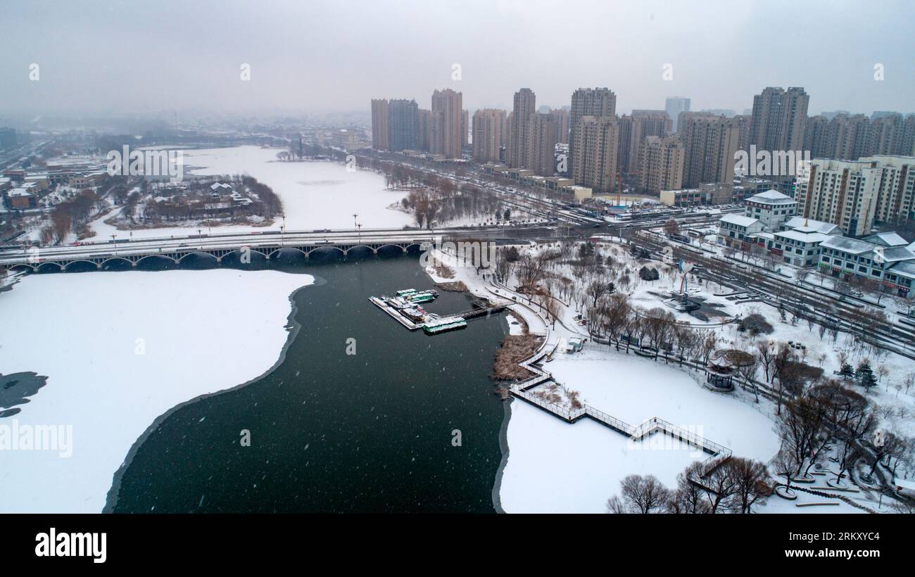 Snowscape of waterfront city, aerial photo Stock Photo - Alamy