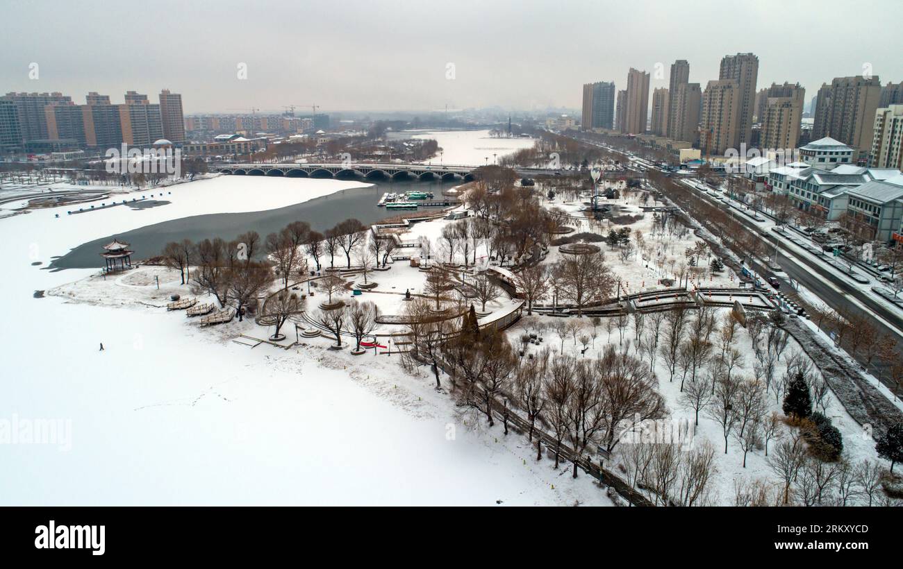 Snowscape of waterfront city, aerial photo Stock Photo - Alamy