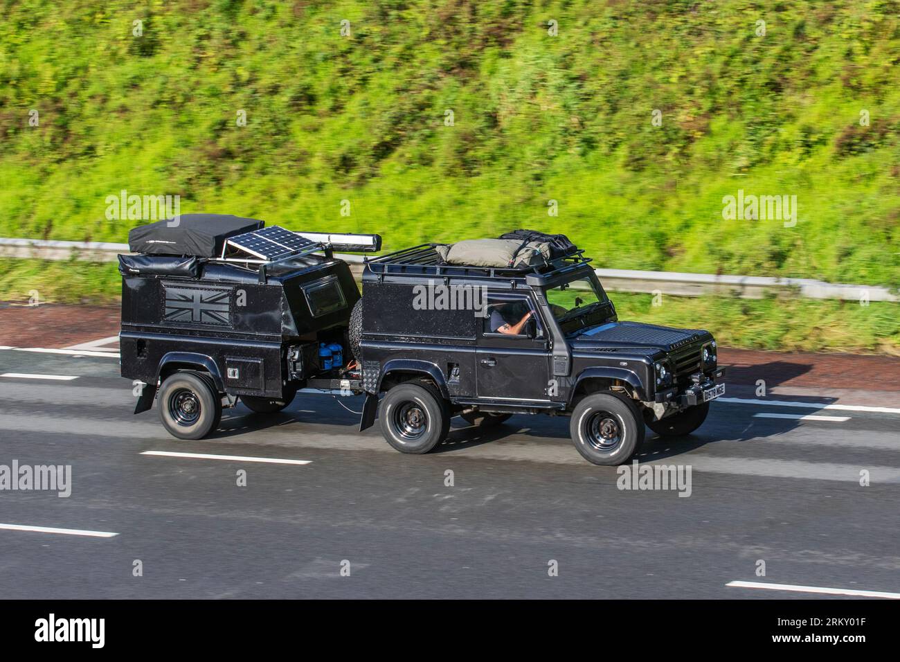 Camping trailer with Solar Panels being towed by 1986 British Landrover ...