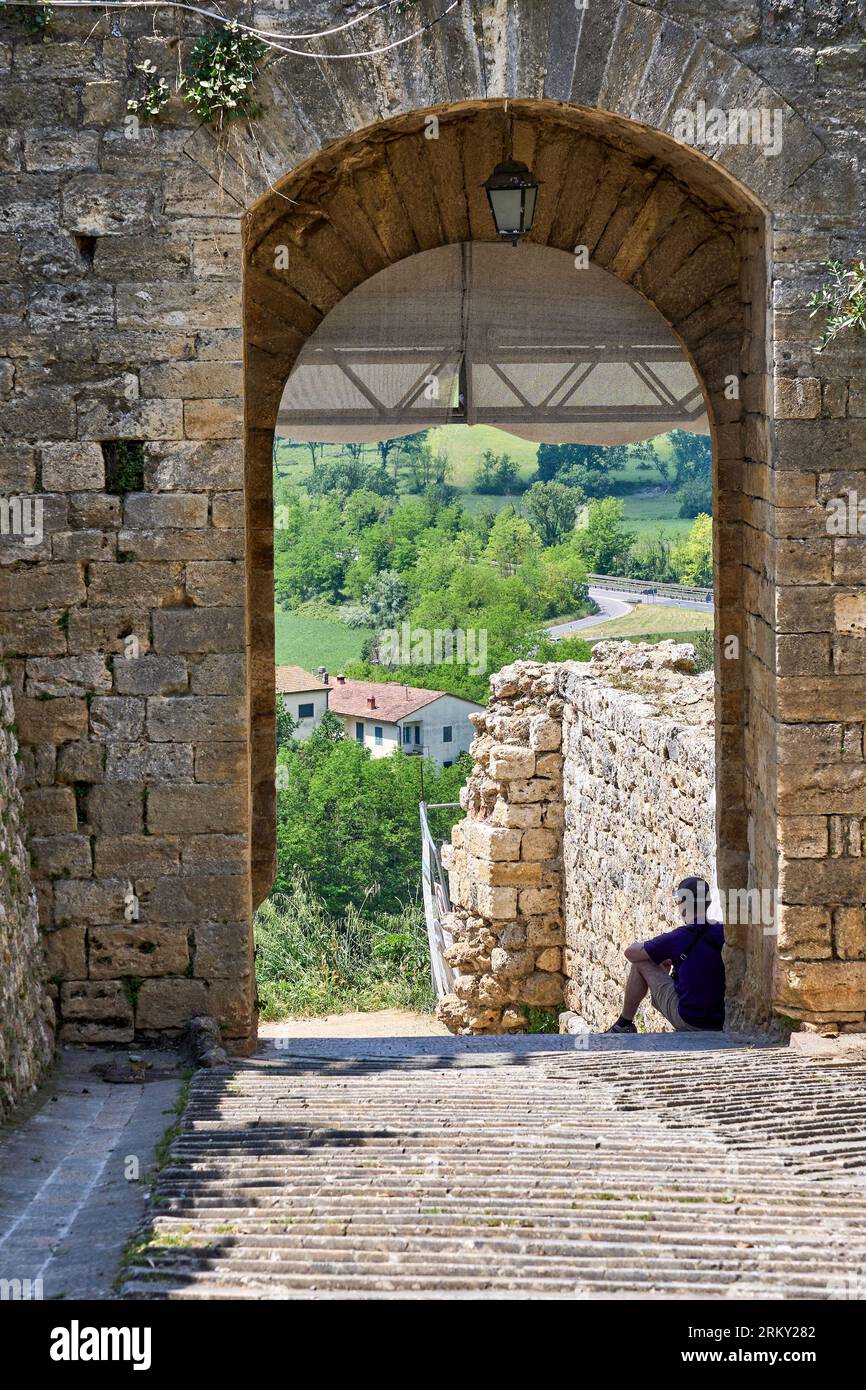 Vertical man sitting gate hi-res stock photography and images - Alamy