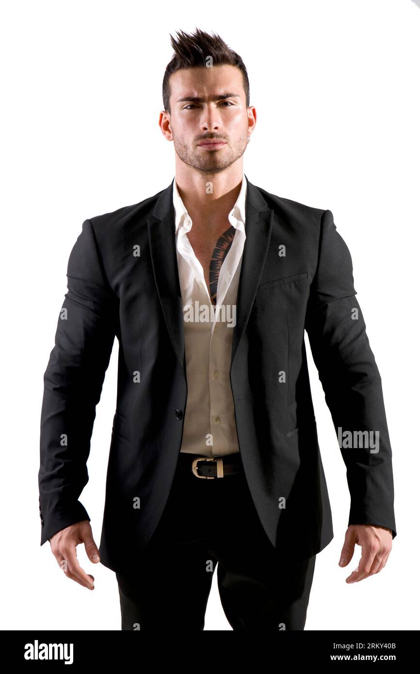 Photo of a handsome man striking a pose in a sleek suit and tie Stock ...