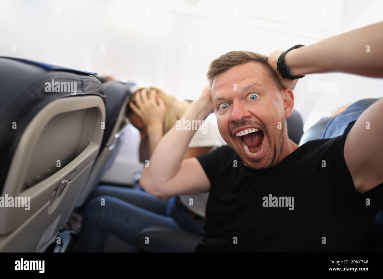 Headache in airplane man hi-res stock photography and images - Alamy