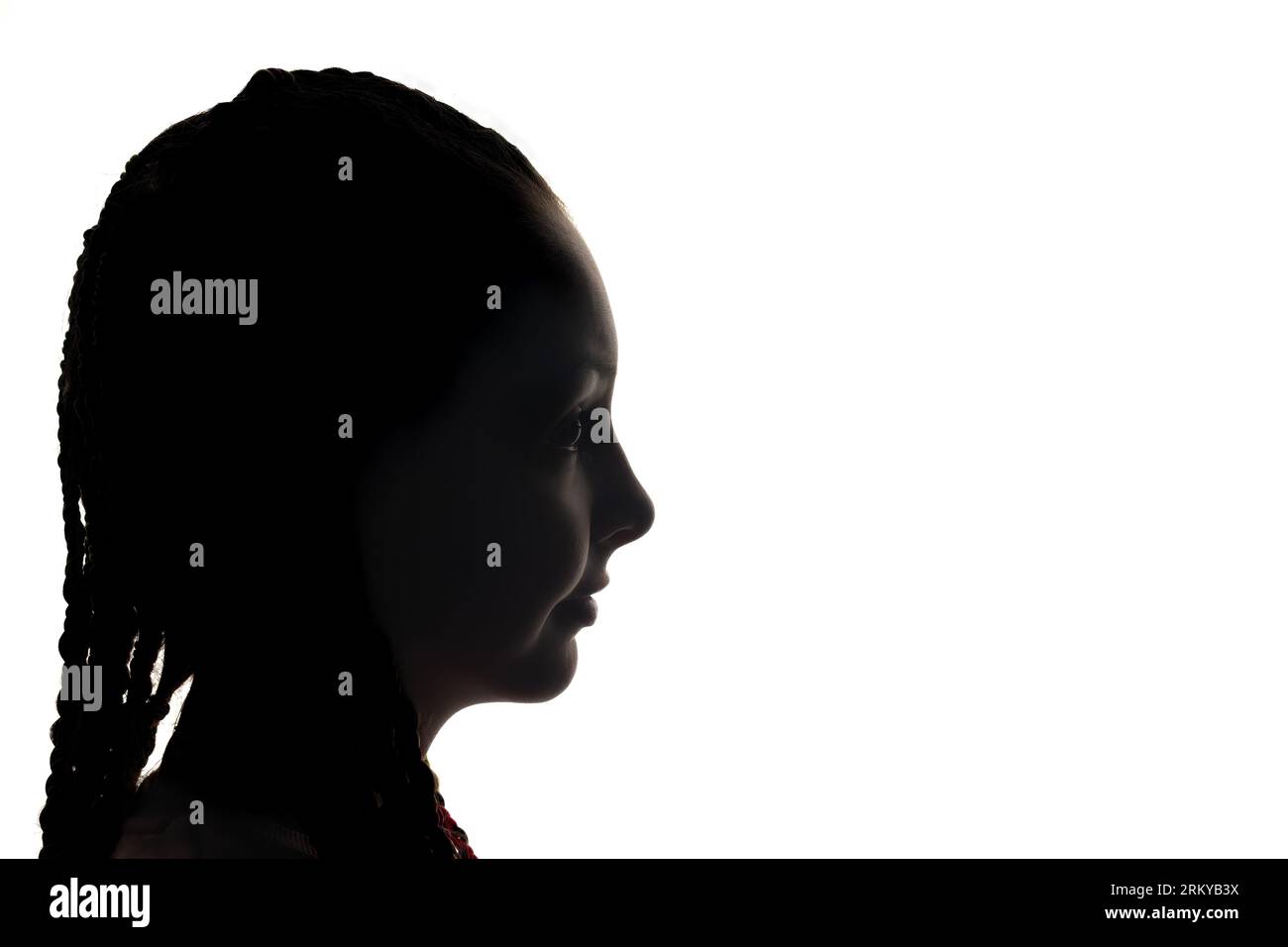 The girl portrait profile in silhouette shadow on studio. White ...
