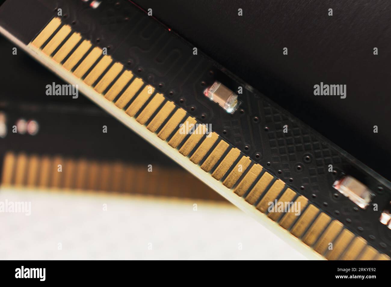 DDR4 DRAM memory module golden electrical contact macro. Computer RAM chipset close-up. Desktop ...
