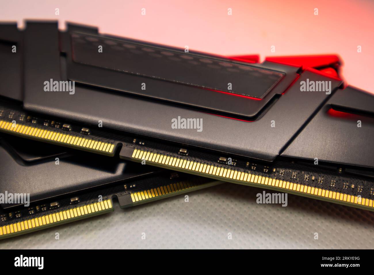 DDR4 DRAM memory modules in red light. Computer RAM chip close-up on ...