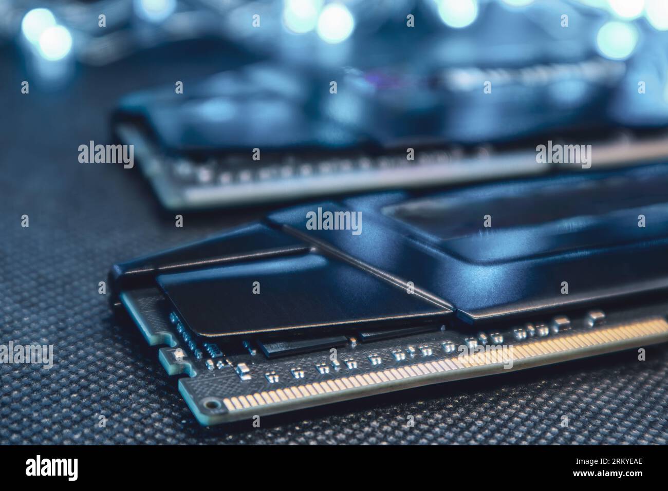 DDR4 DRAM memory modules in blue bright light. Computer RAM chipset close-up. Desktop PC ...