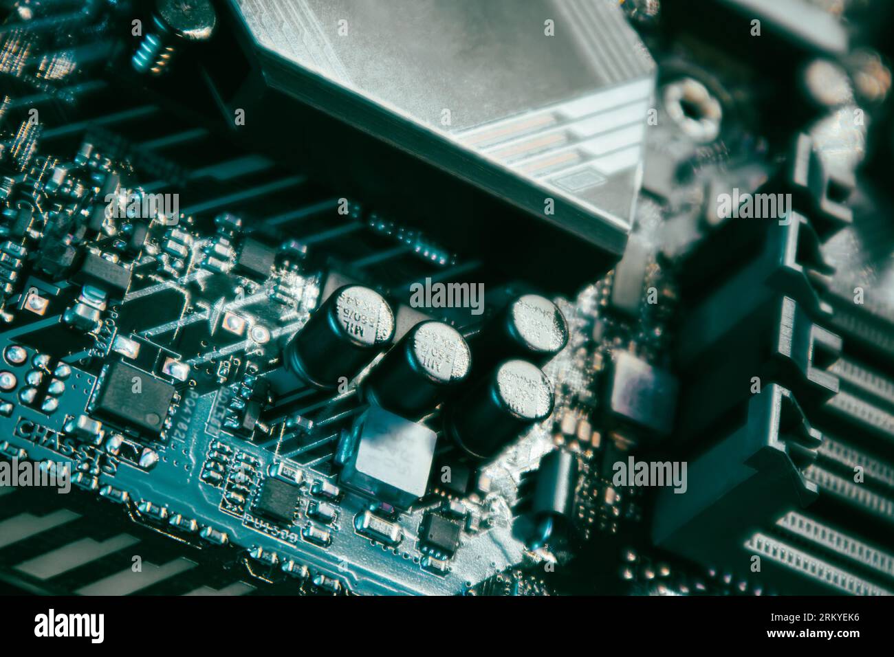 Motherboard with sockets and resistors close-up on modern powerful desktop PC. Computer hardware ...