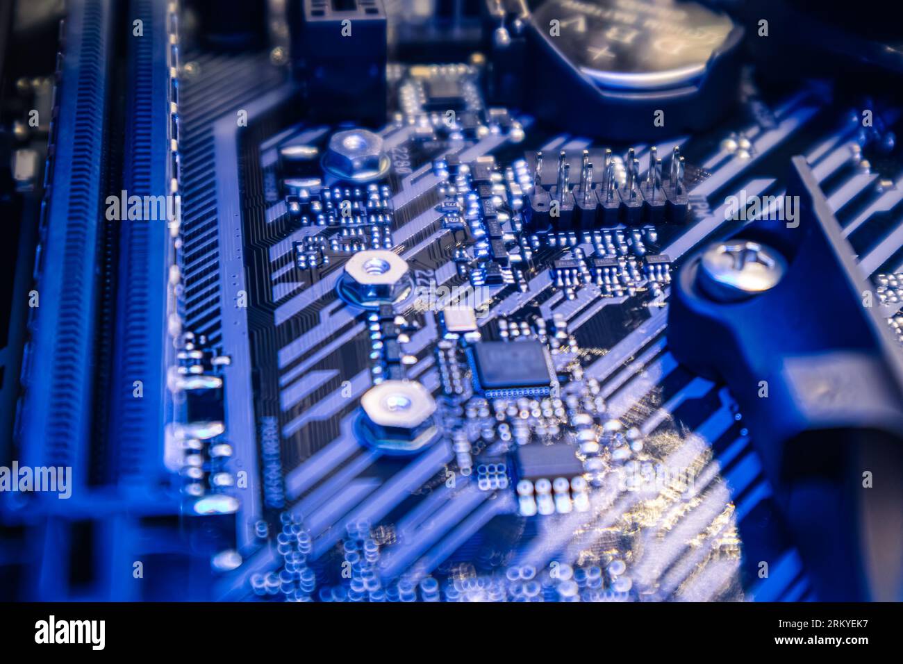 Motherboard with sockets close-up on modern powerful desktop PC. Computer hardware chipset ...