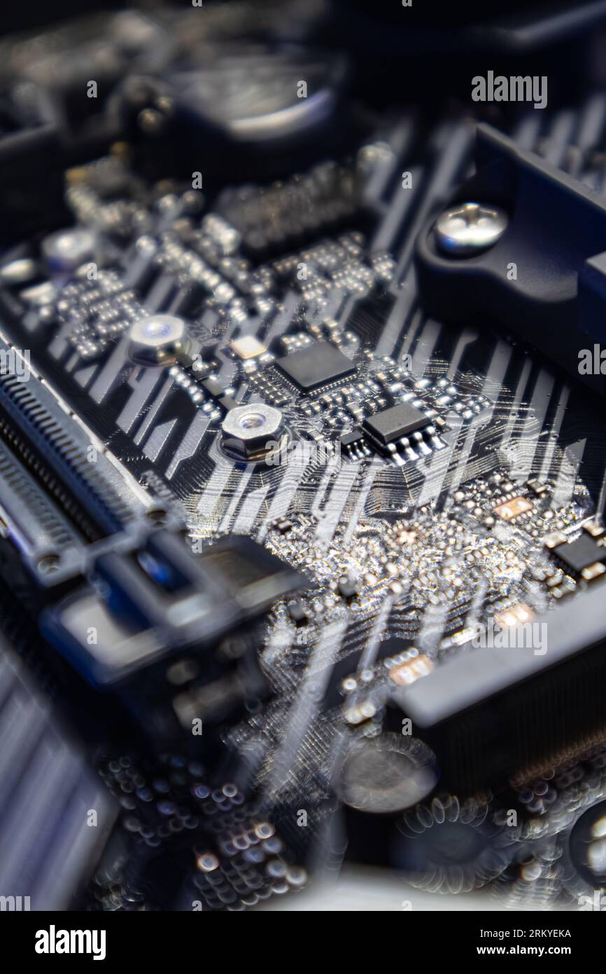 Motherboard with sockets and microchips close-up on modern powerful ...