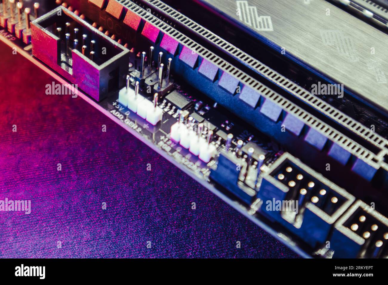 Motherboard with connectors and microchips close-up on modern desktop ...