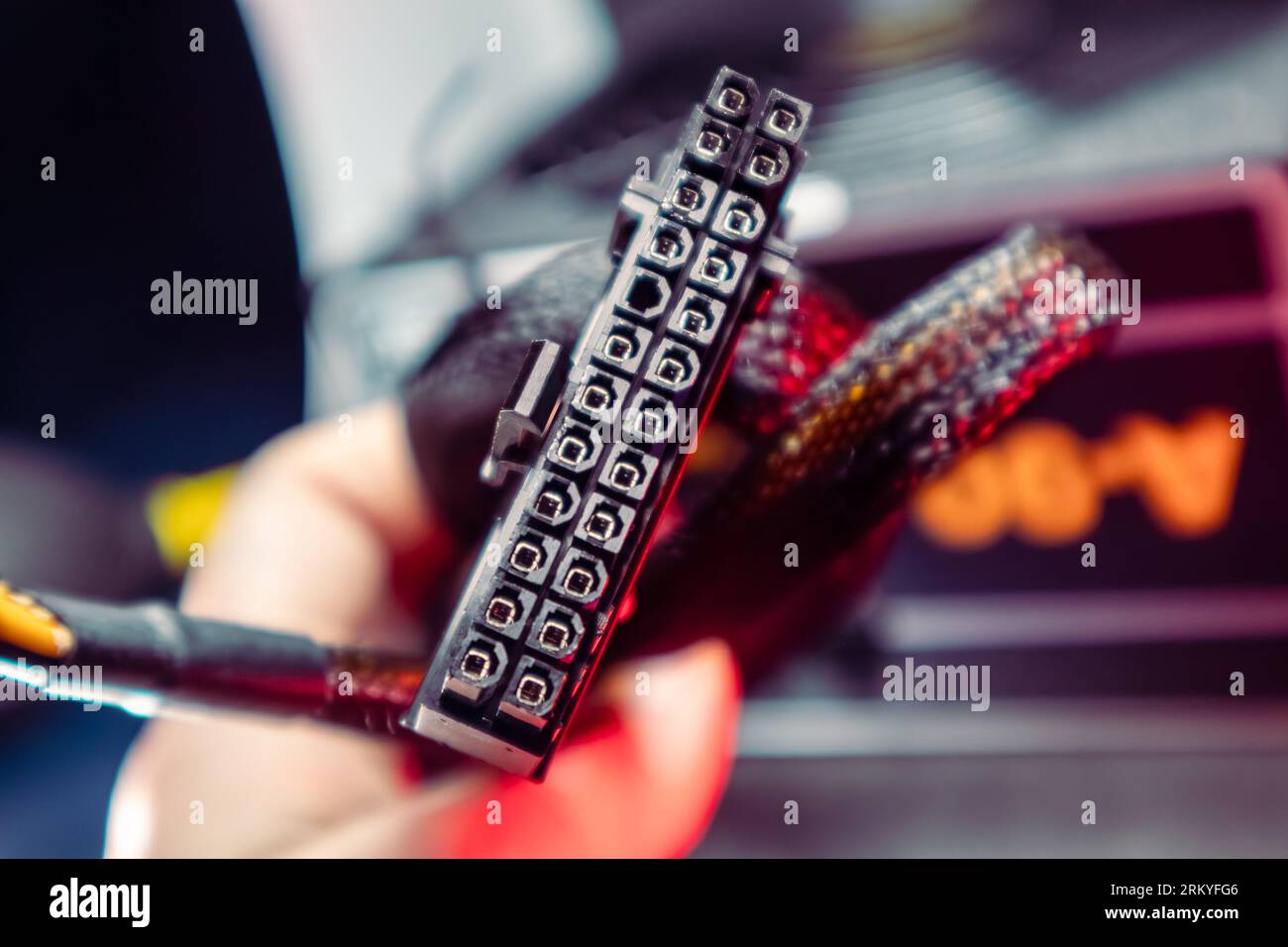 Cable connector (24 pin) from power supply of desktop PC close-up with ...