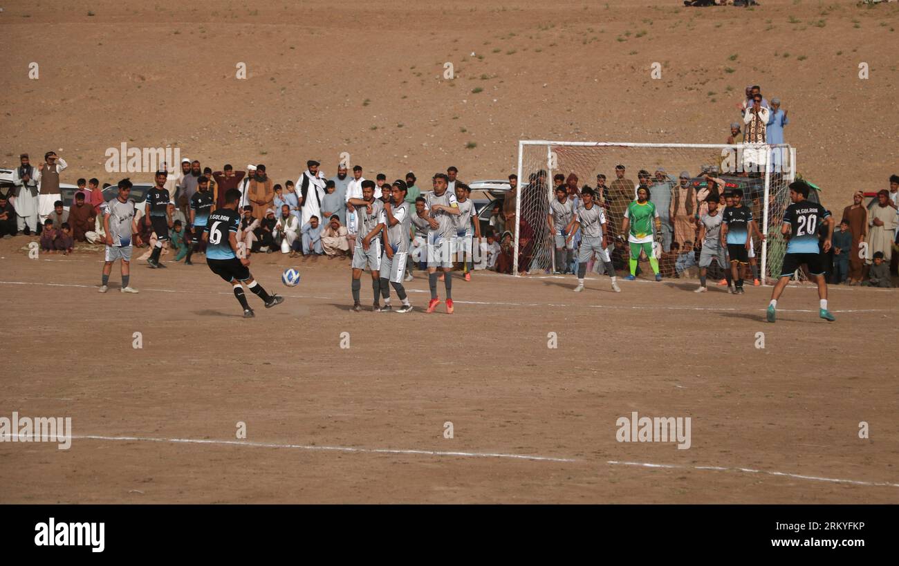 Herat, Afghanistan. 25th Aug, 2023. Young Afghans play football on a ...