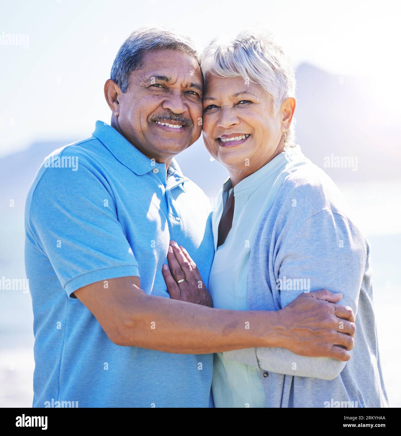 Love, portrait and senior couple at beach, hug or travel, bond and ...